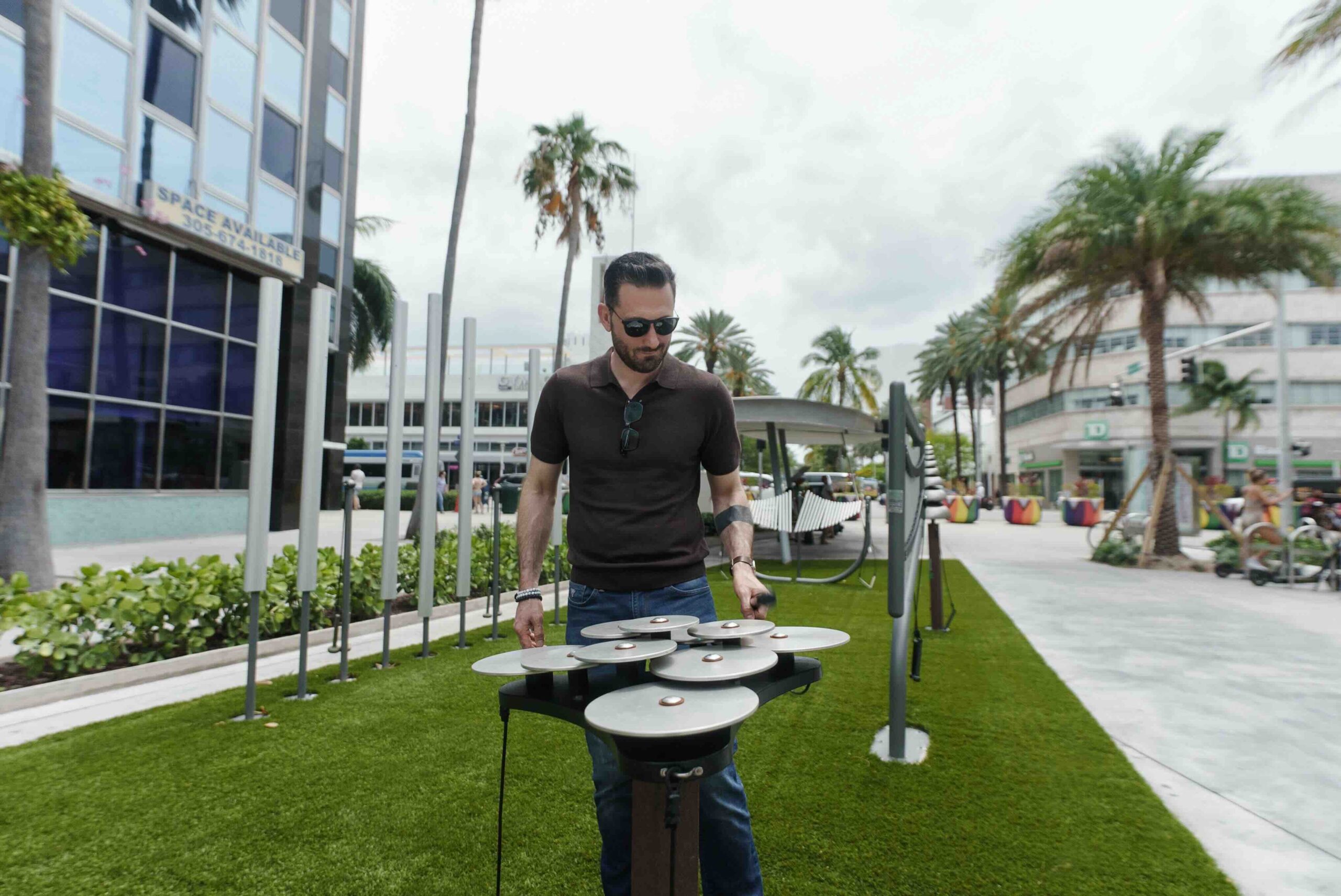 People peacefully play instruments in public on Lincoln Road